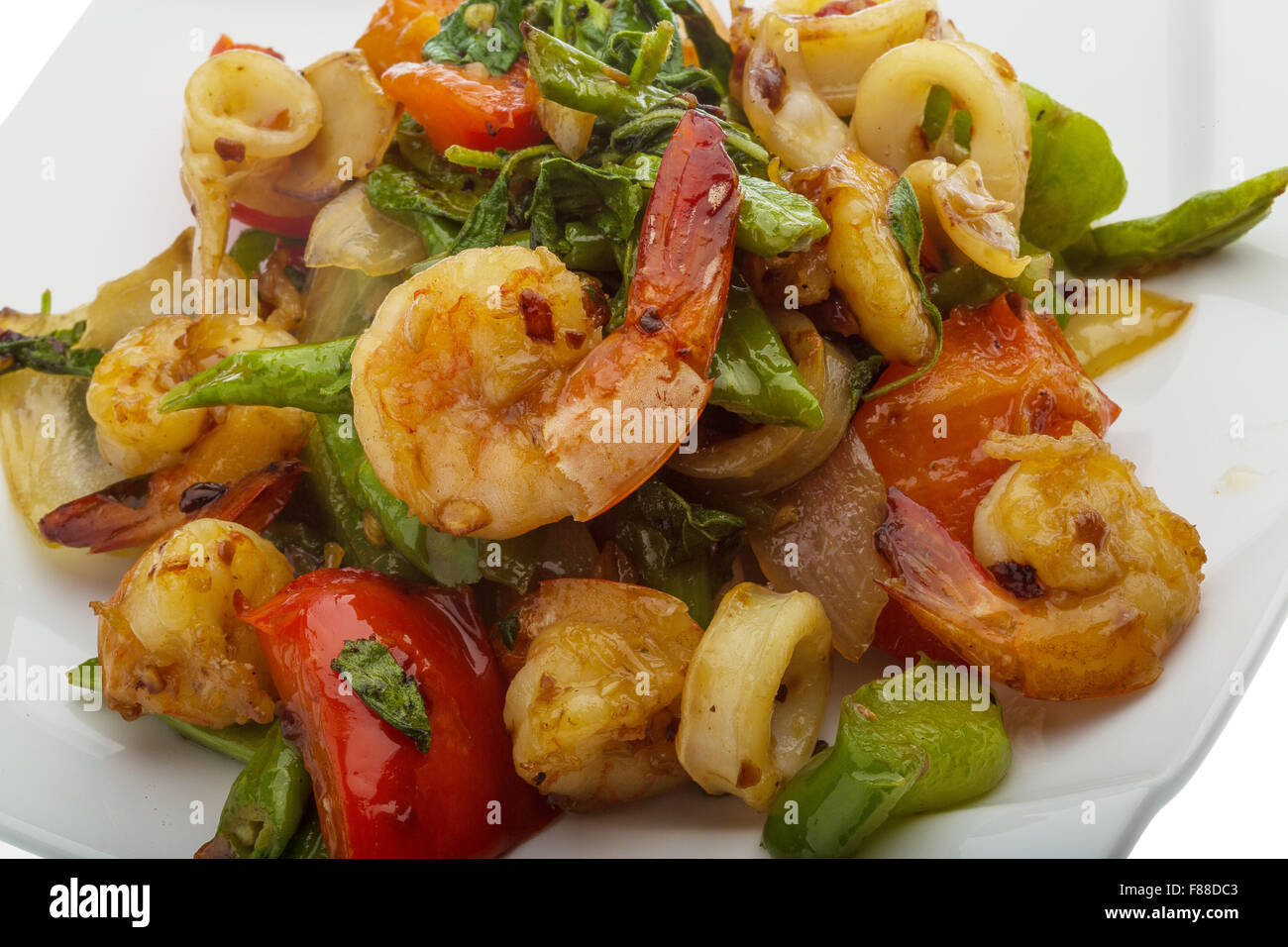 Seafood with vegetables - shrimps and calamari Stock Photo - Alamy