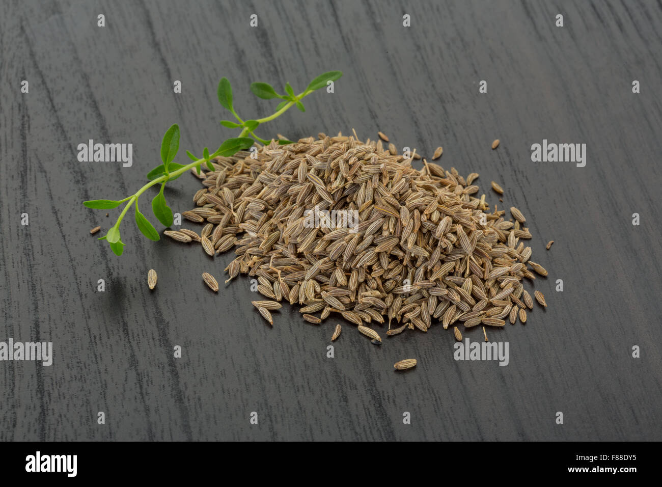 Zira seeds heap on the desk Stock Photo - Alamy
