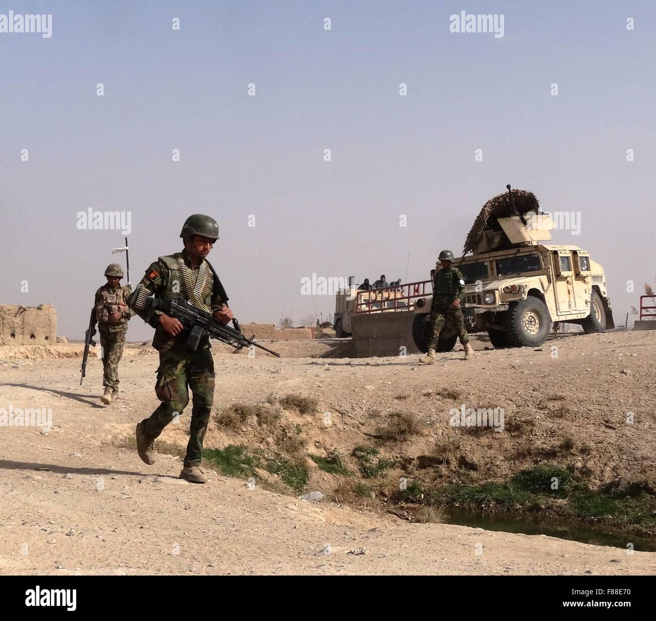 Helmand. 6th Dec, 2015. Afghan army soldiers walk during a military ...