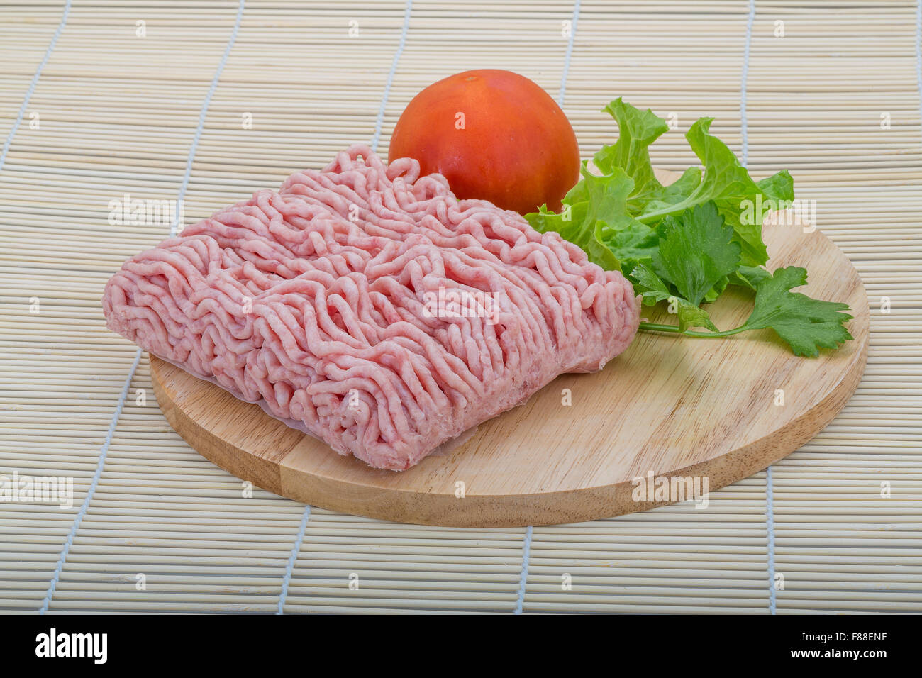 Raw minced pork meat on the desk with herbs Stock Photo - Alamy