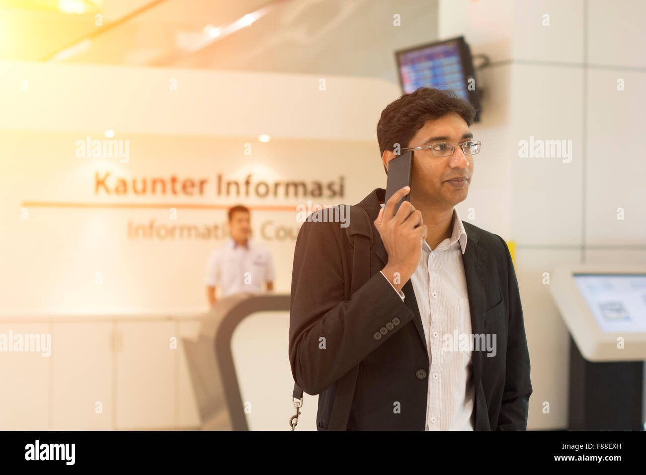 indian male at information counter Stock Photo - Alamy
