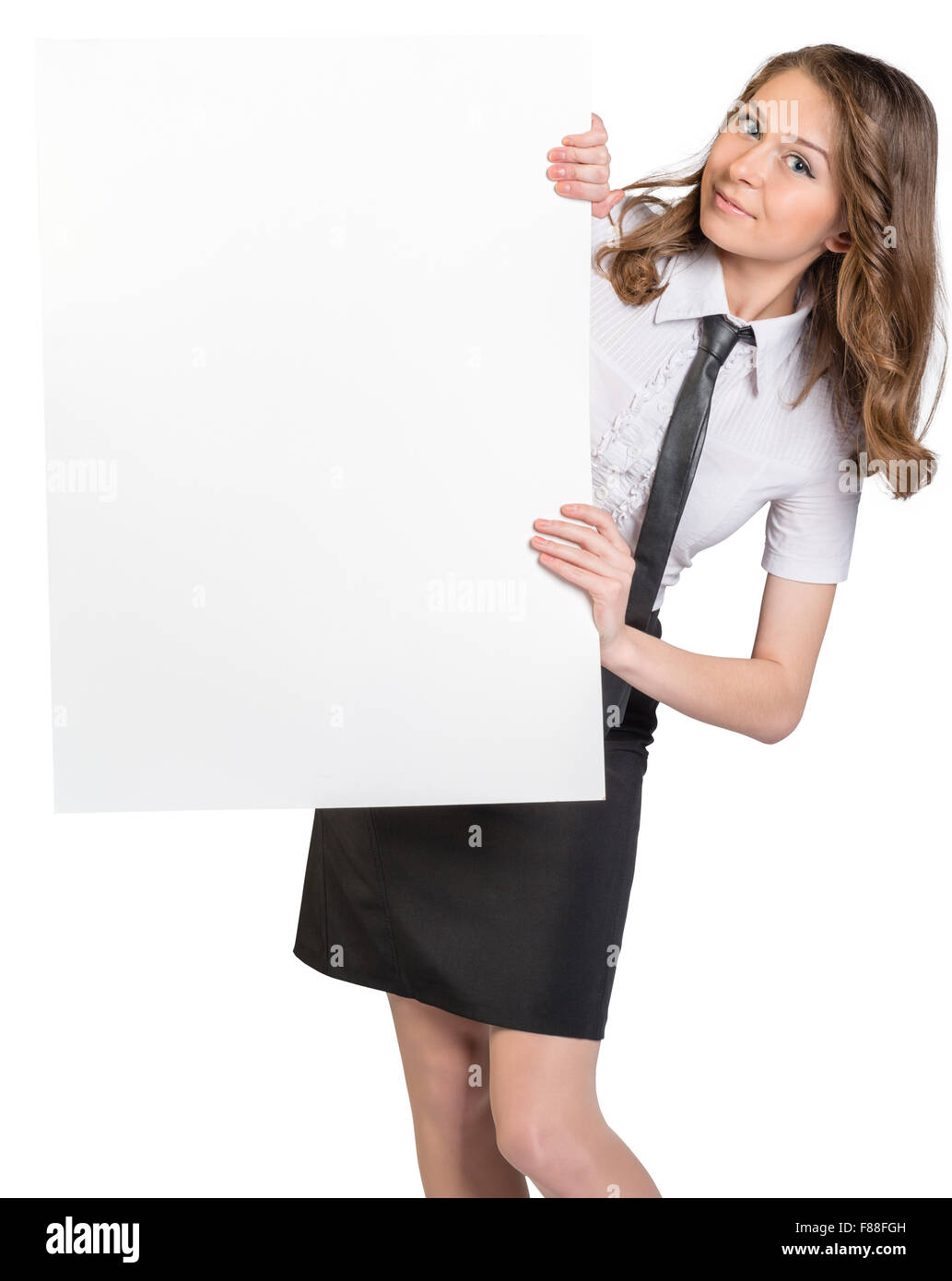Woman looks out from behind a large blank poster Stock Photo - Alamy