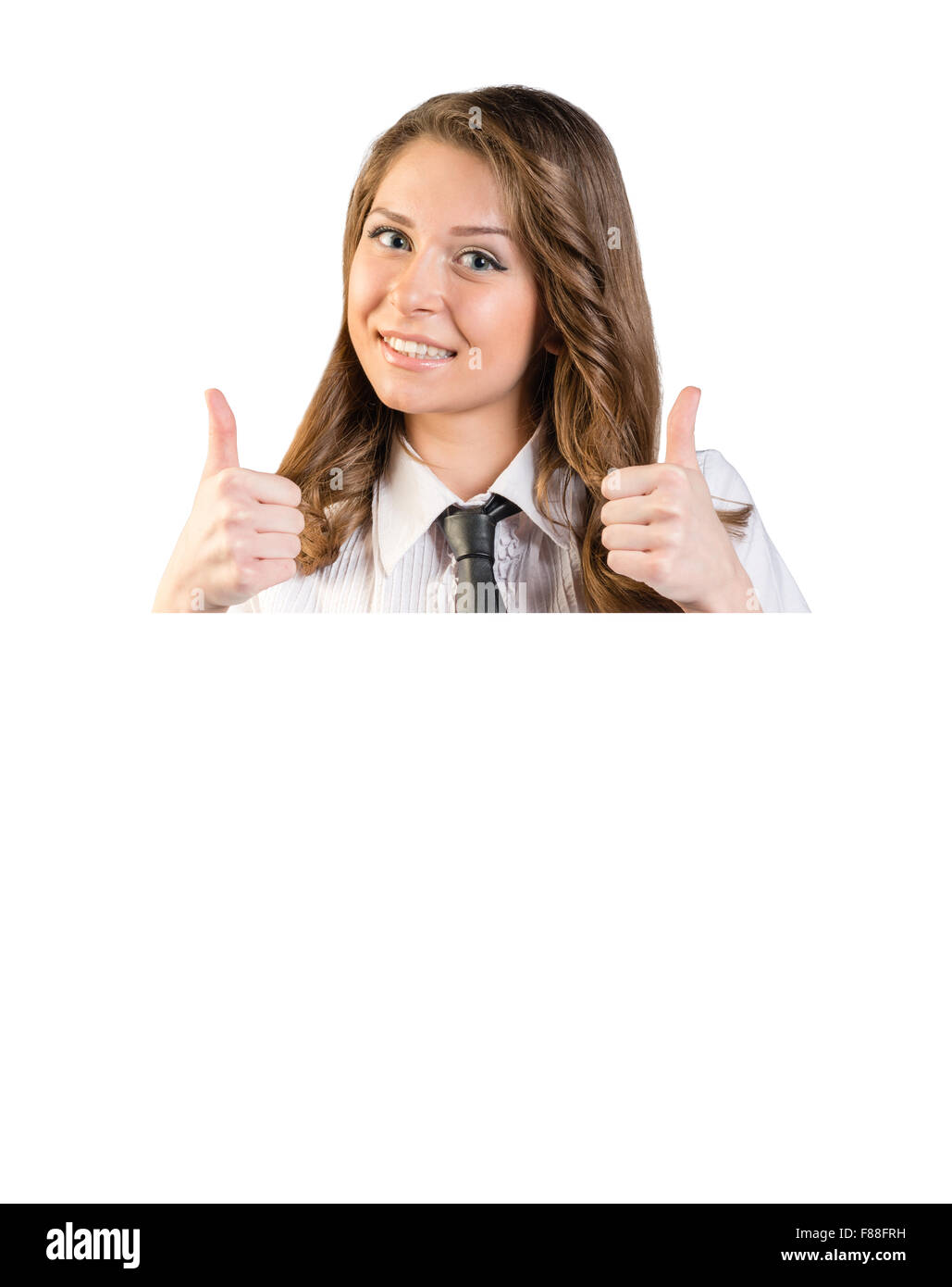 Girl shows thumb-up sign standing behind a white placard Stock Photo ...