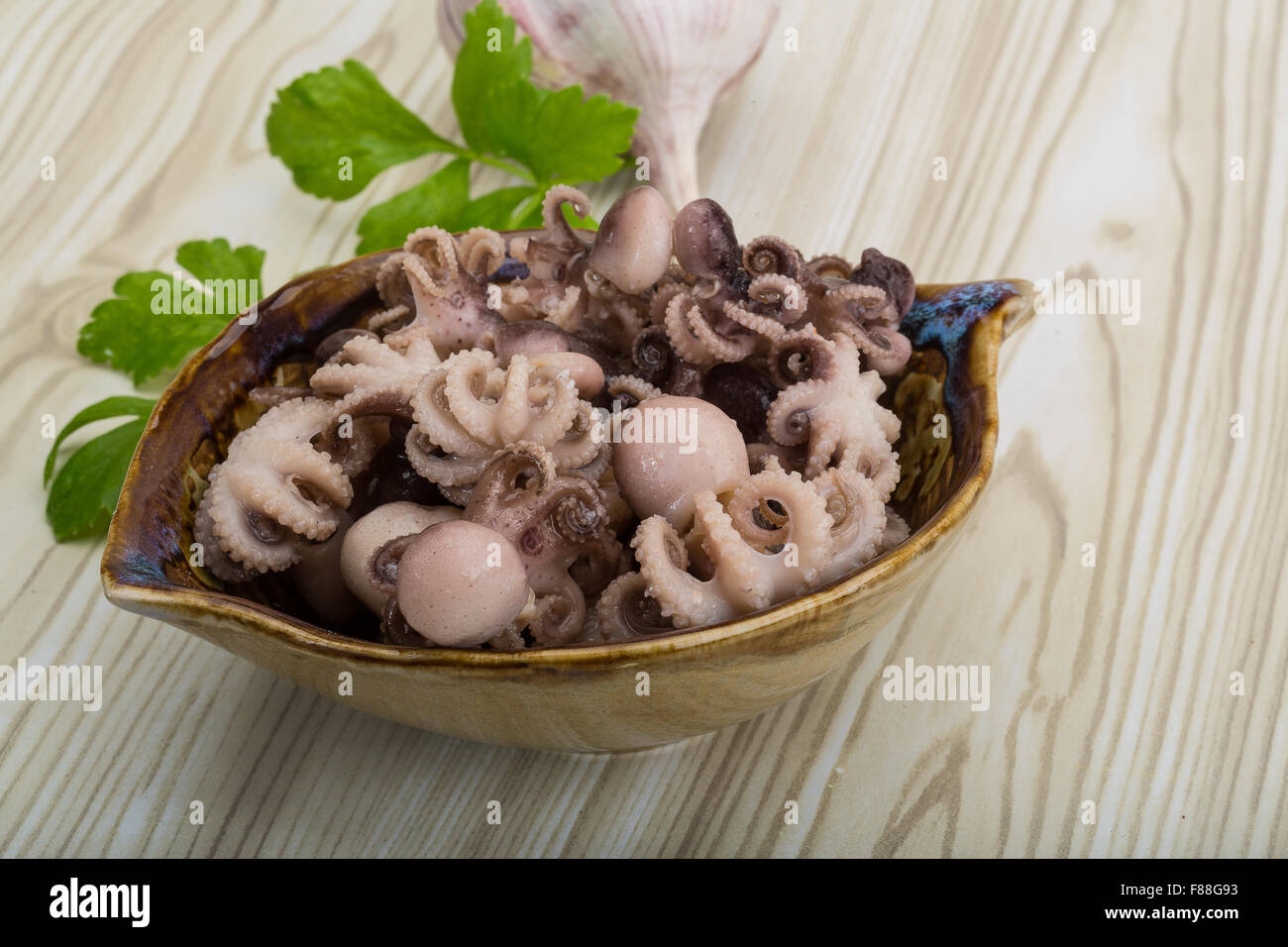 Boiled octopus - mini seafood in the bowl Stock Photo - Alamy