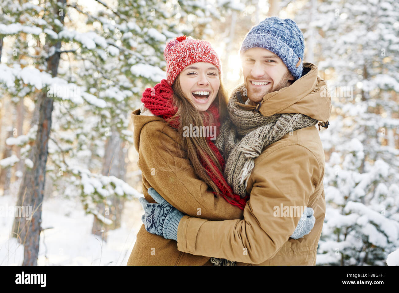 Ecstatic dates in winterwear enjoying nice time Stock Photo - Alamy