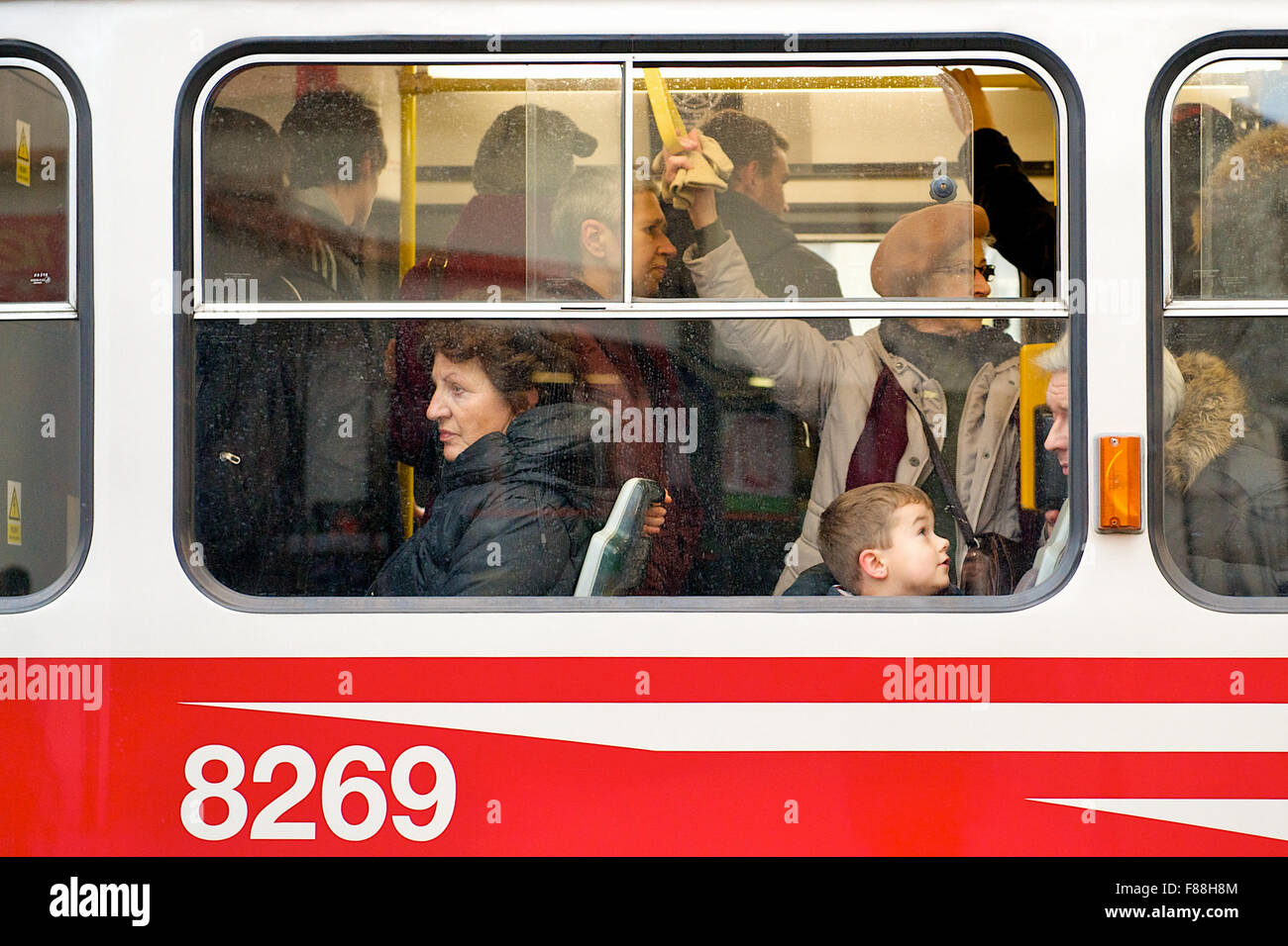 Passengers travel aboard a crowded tram in Prague City Czech Republic ...