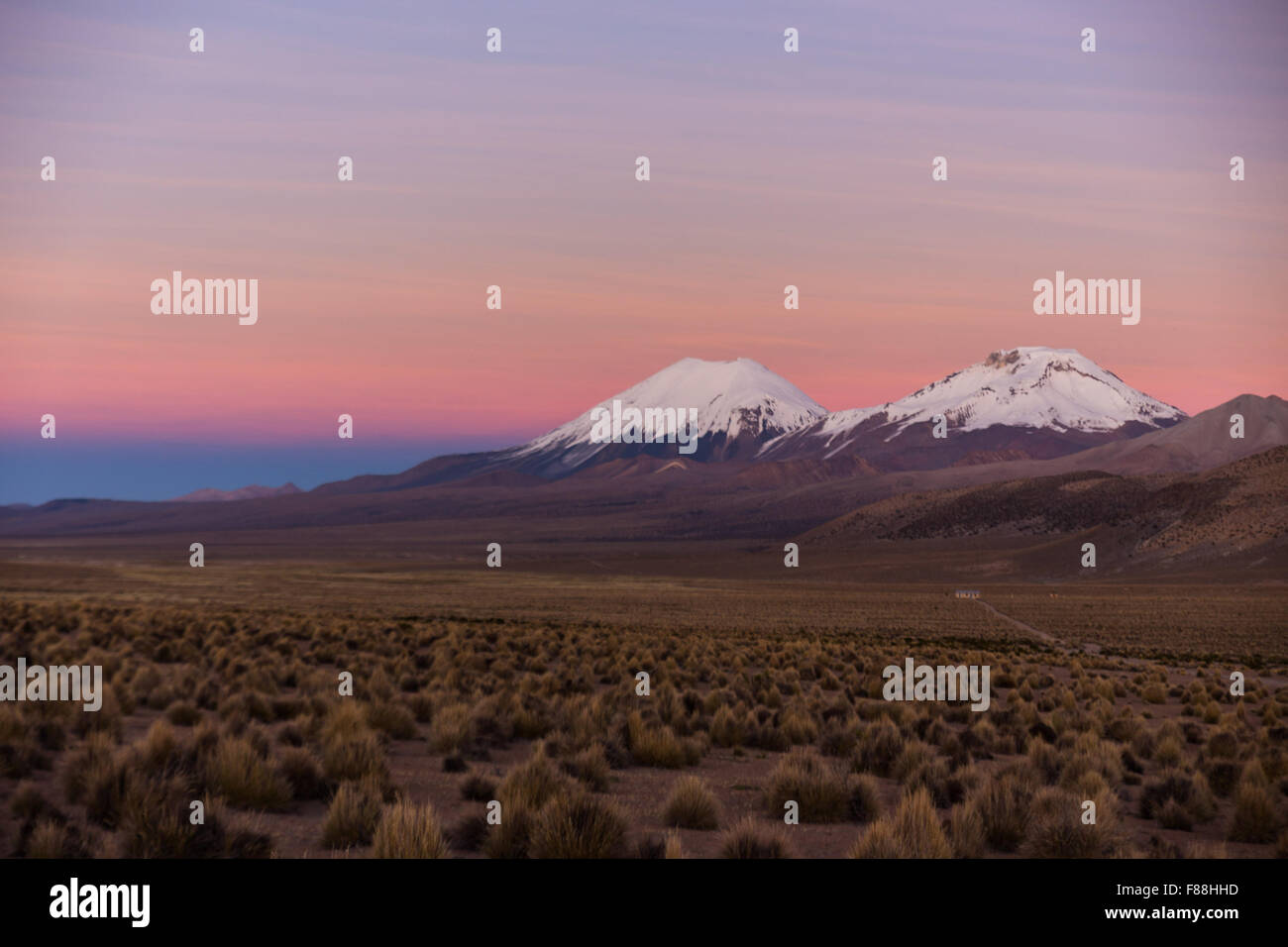 Sunset in Andes. Parinacota and Pomerade volcanos. High Andean ...