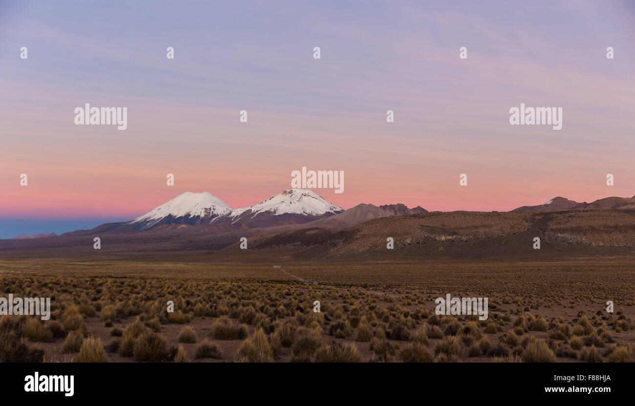 Sunset in Andes. Parinacota and Pomerade volcanos. High Andean ...