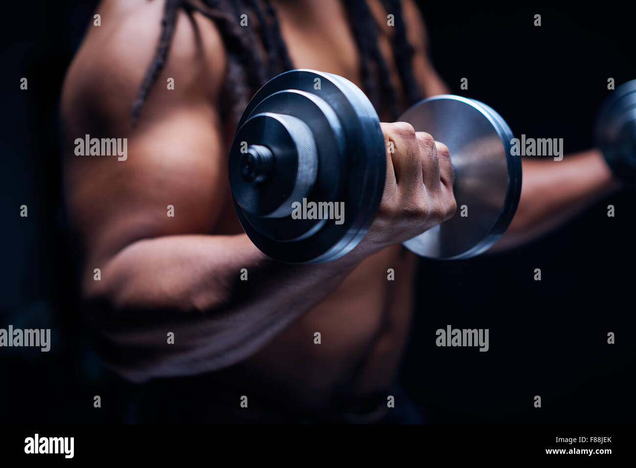 Man lifting a heavy weight Stock Photo - Alamy