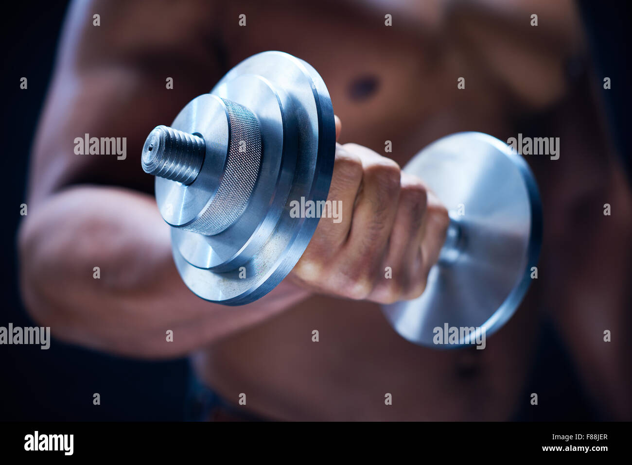 Close-up of male hand holding metal barbell Stock Photo - Alamy