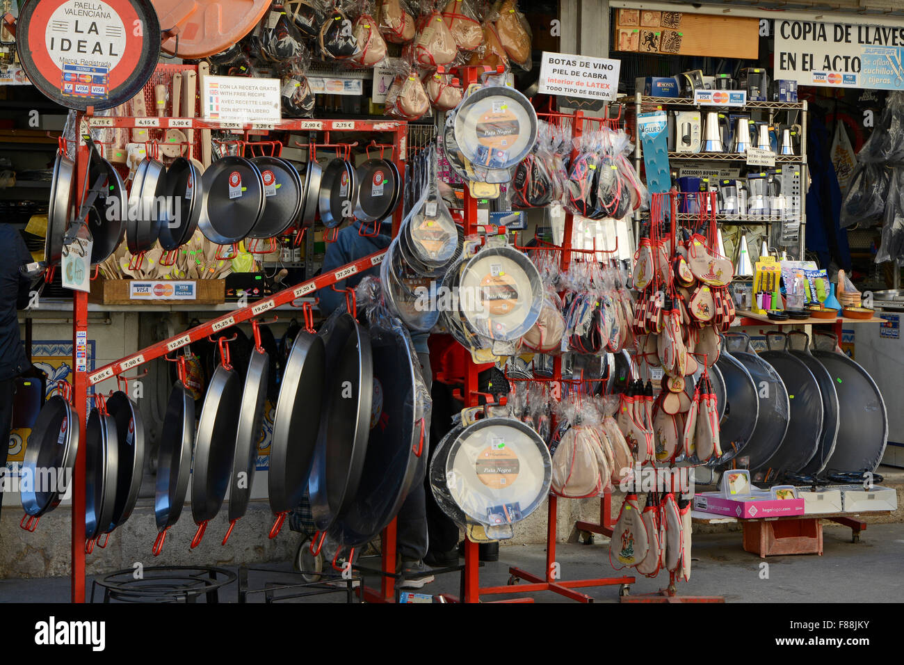 Hardware and cookware shop with outdoor display of pots and paella pans ...