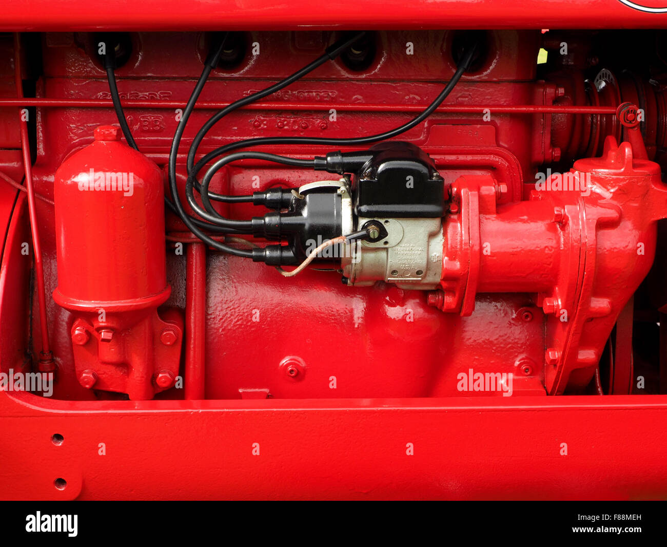 detail of painted engine of red tractor with pipework and cables Stock ...