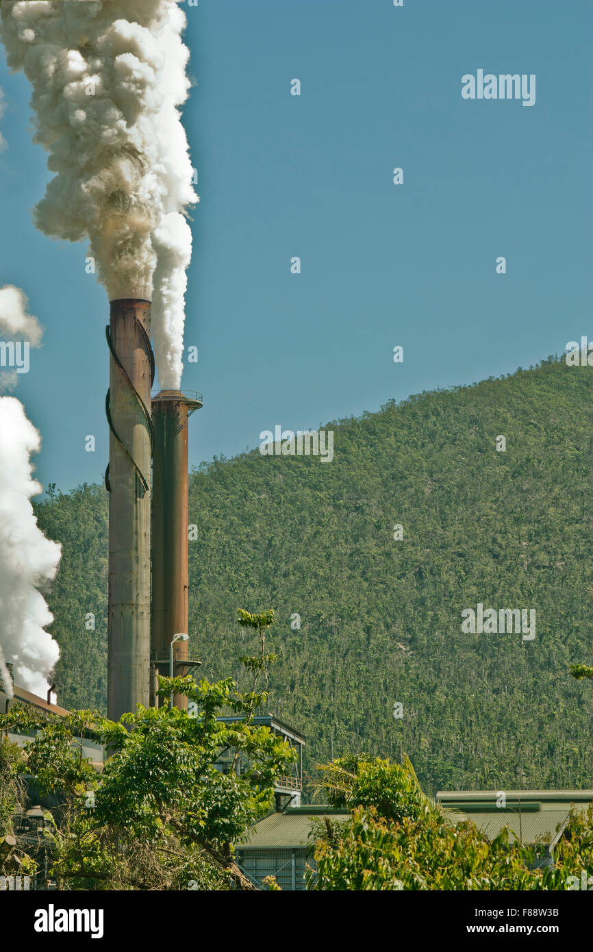 two tall chimney stacks blowing out smoke Stock Photo - Alamy