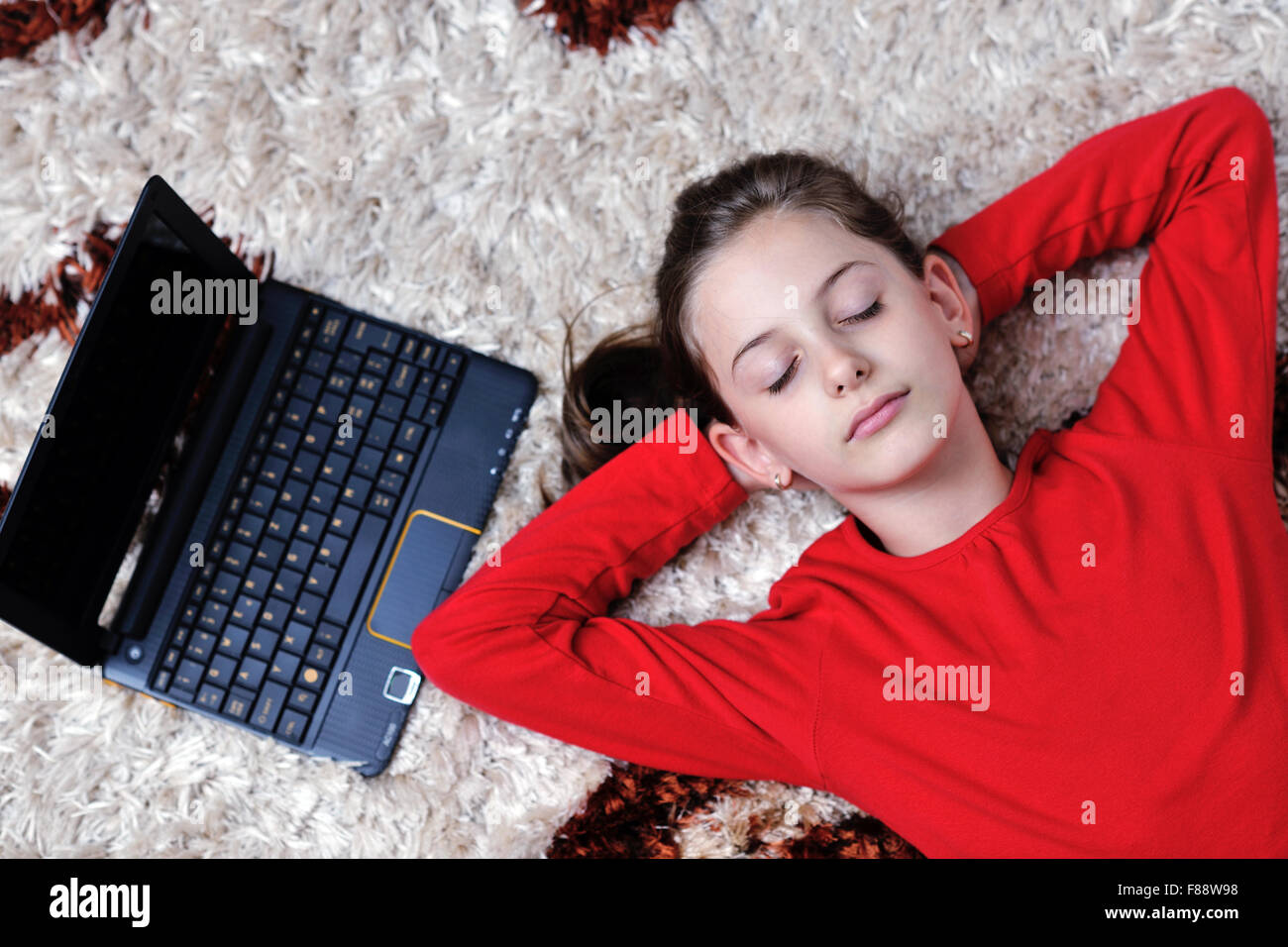 happy child school girl relax at home with laptop computer in ...