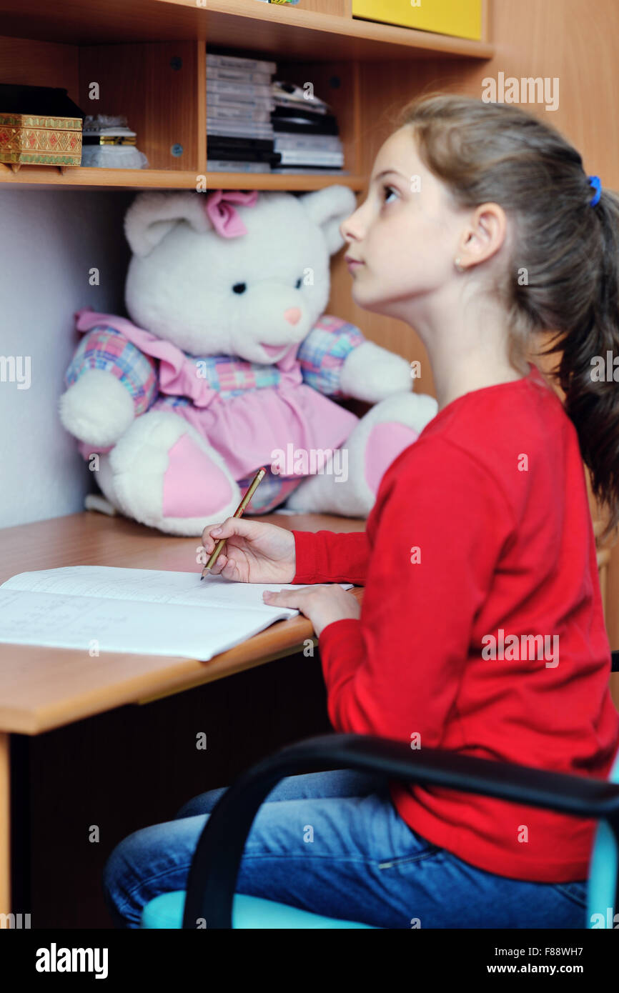 happy young school girl doing homework at home Stock Photo - Alamy