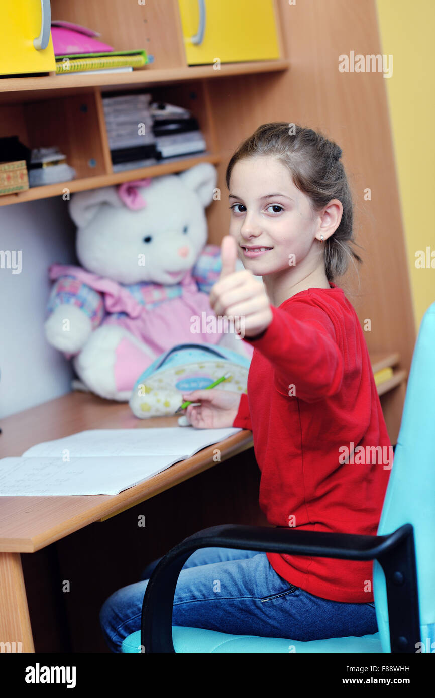 happy young school girl doing homework at home Stock Photo - Alamy