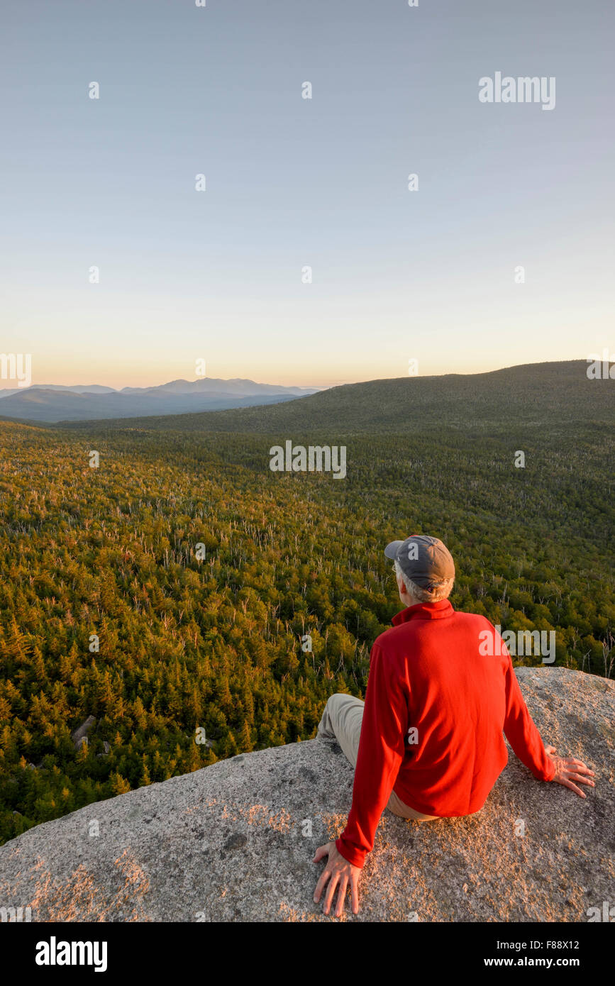 Hiker on Roger's Ledge at sunset, White Mountain National Forest, New ...
