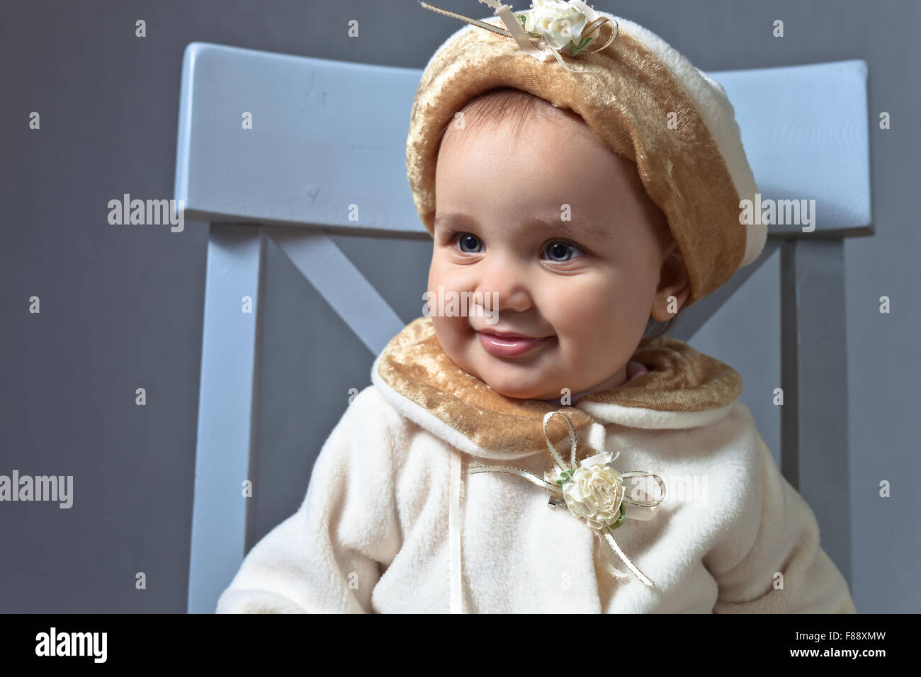 Portrait of a little girl in beige coat Stock Photo - Alamy