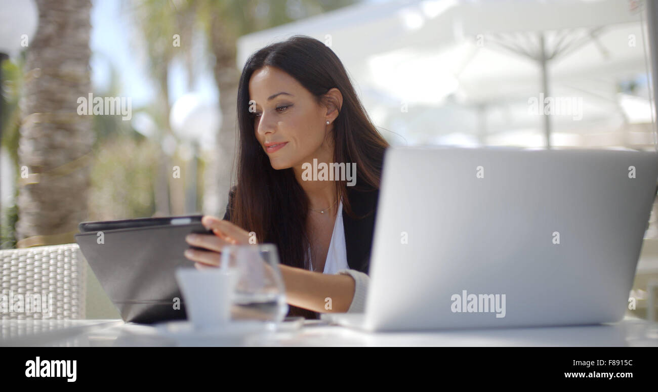 Businesswoman making a call at a restaurant Stock Photo - Alamy