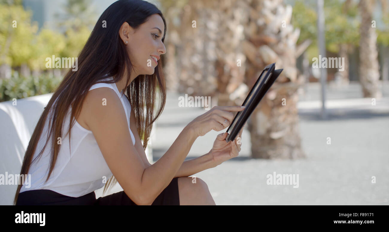 Pretty young woman surfing the internet Stock Photo - Alamy