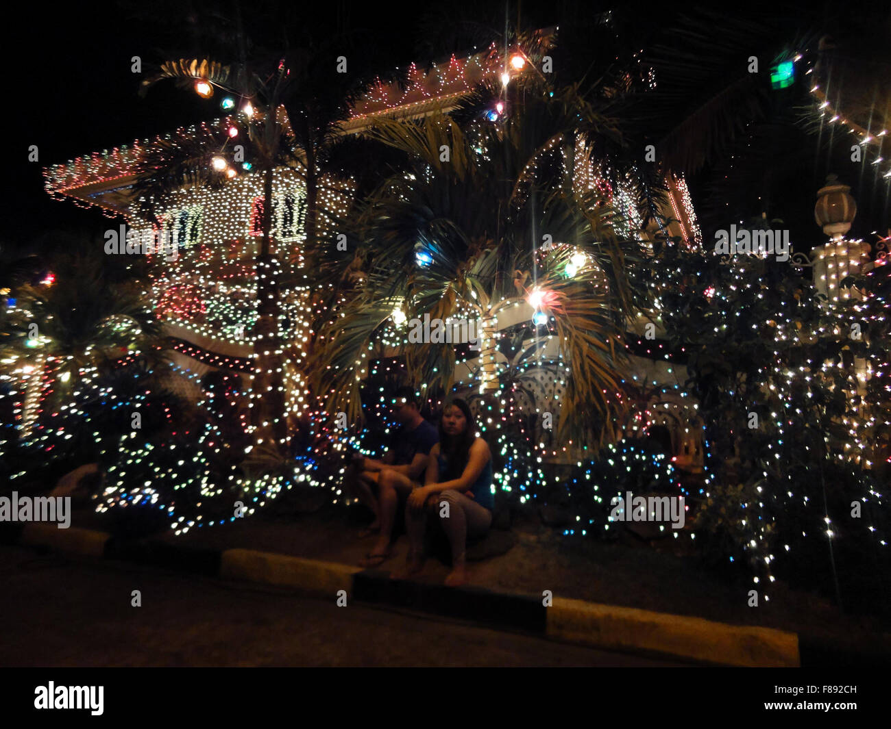 Manila, Philippines. 7th December, 2015. Filipinos take a rest outside ...