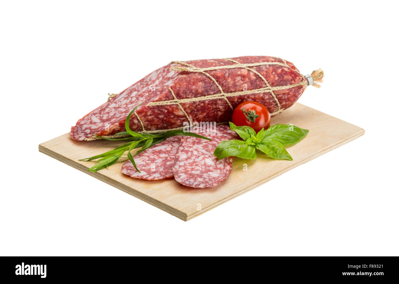 Salami sausages sliced with basil Stock Photo - Alamy