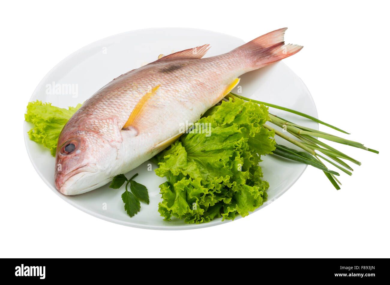 Raw red snapper with salad leaves Stock Photo - Alamy