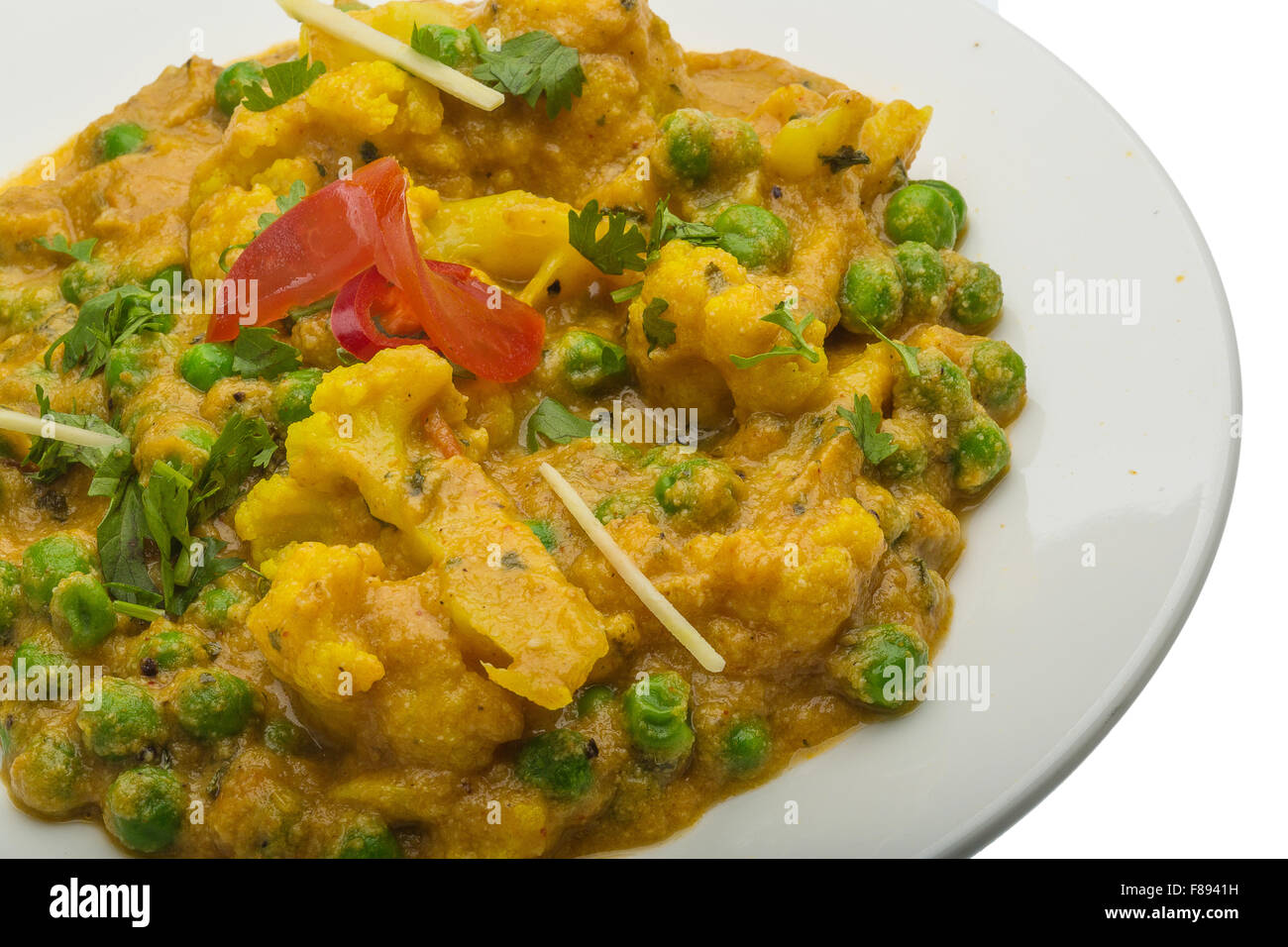Gobi Mutter Kaju - cauliflower with green peas and cashew Stock Photo ...