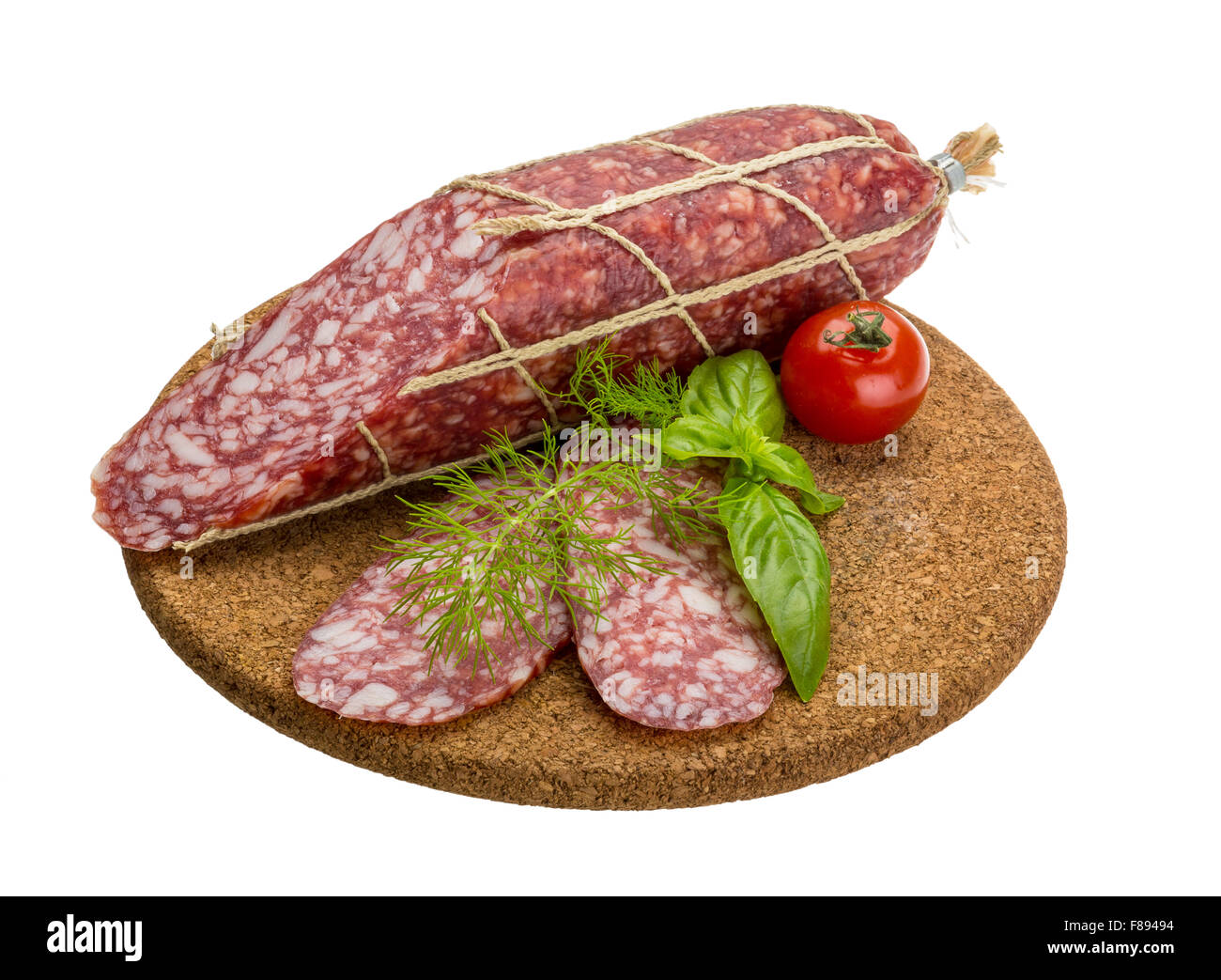 Salami sausages sliced with basil Stock Photo - Alamy