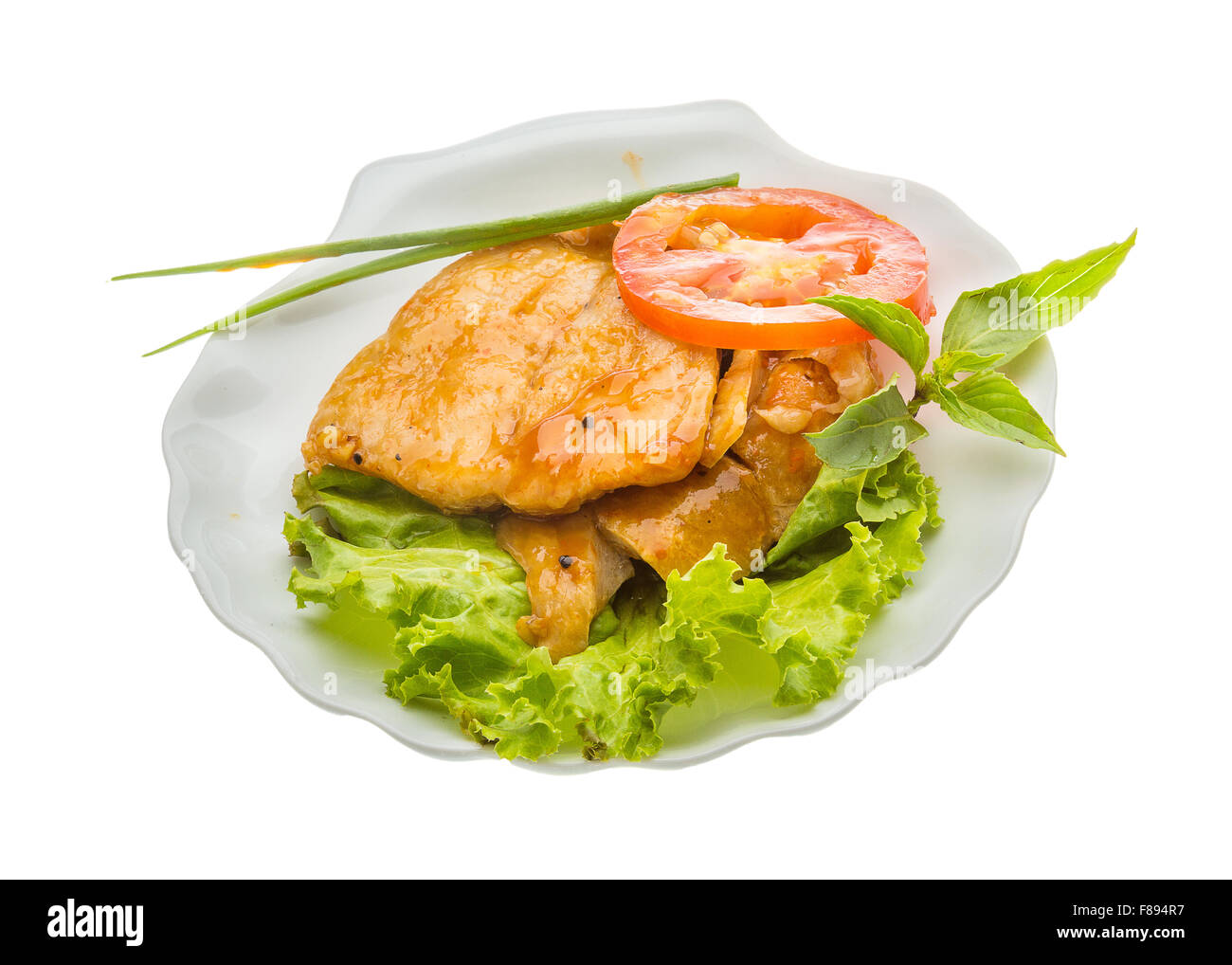 Baracuda steak with sauce and salad Stock Photo - Alamy