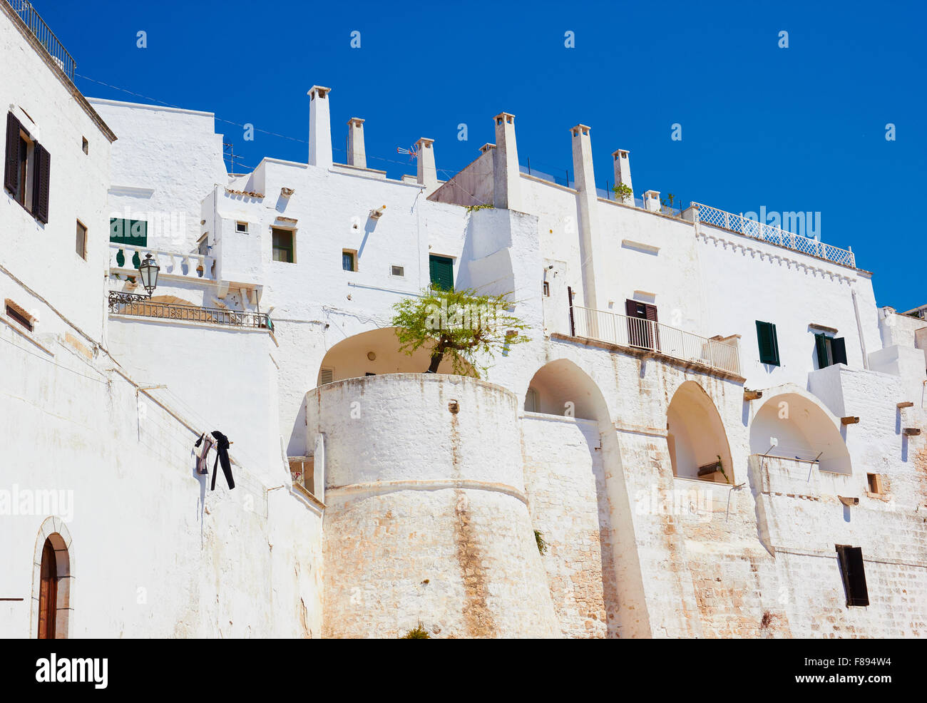 Whitewashed city walls of Ostuni known as La Citta Bianca (the white ...