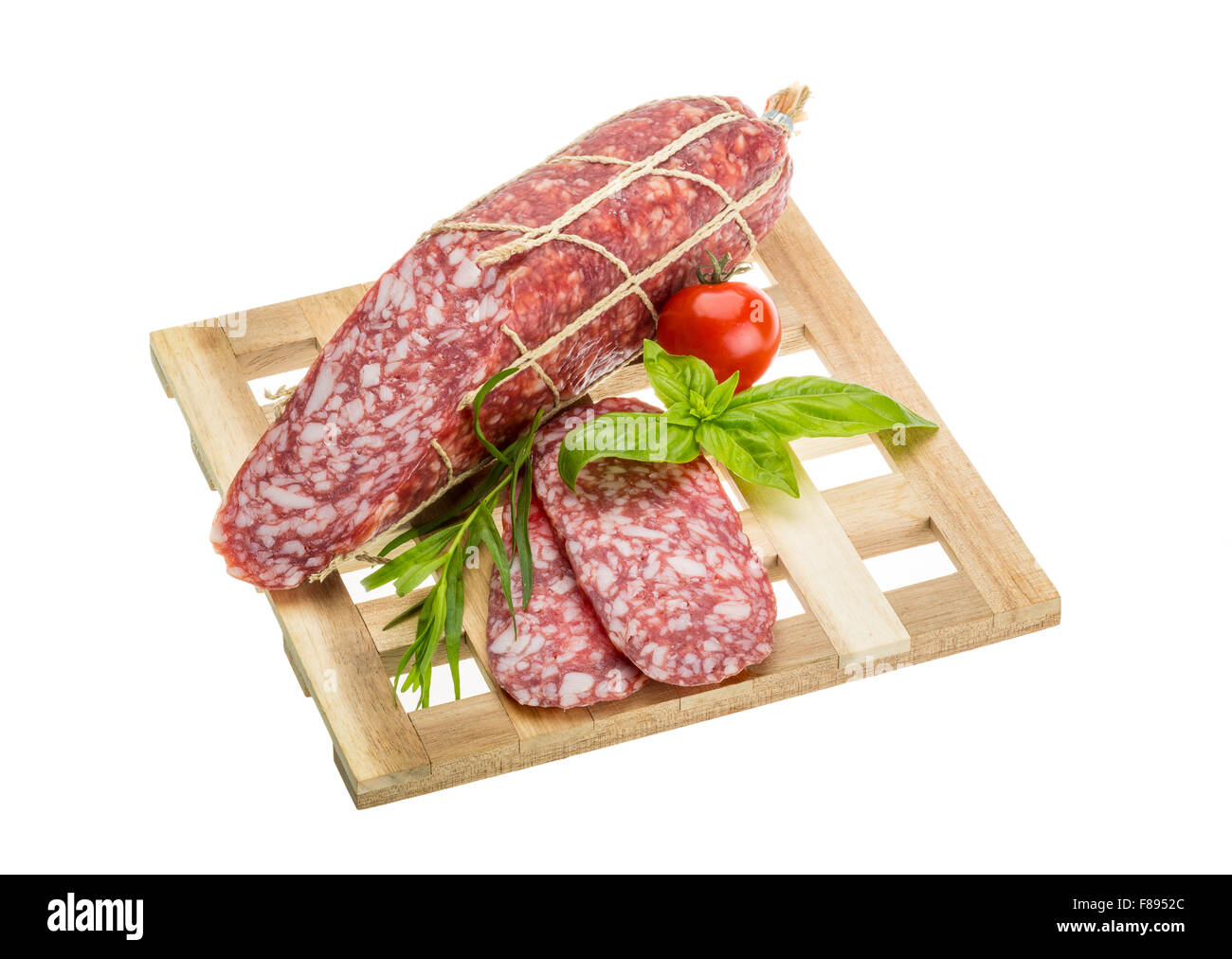 Salami sausages sliced with basil Stock Photo - Alamy