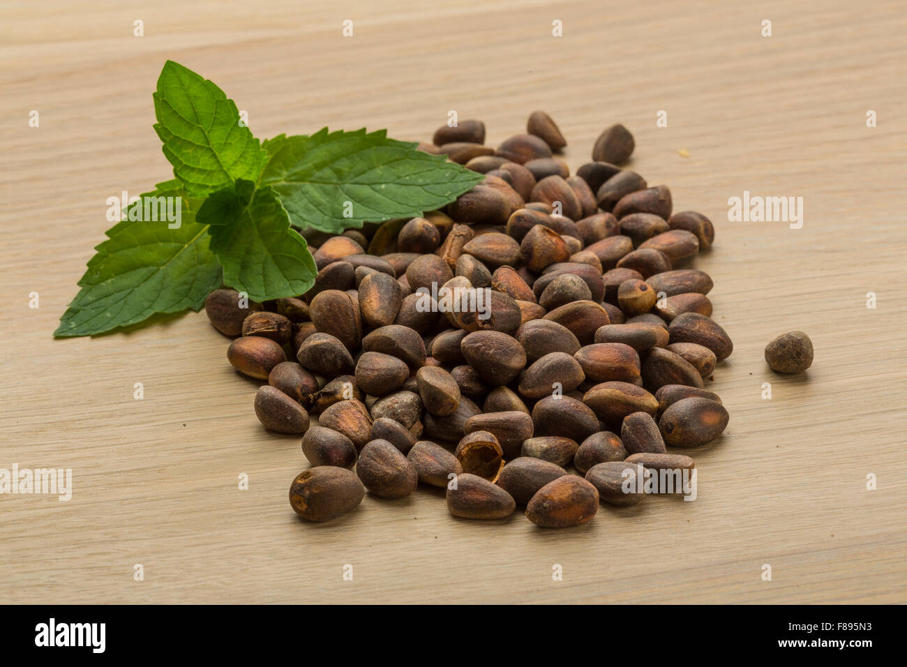 Cedar nuts on the desk Stock Photo - Alamy
