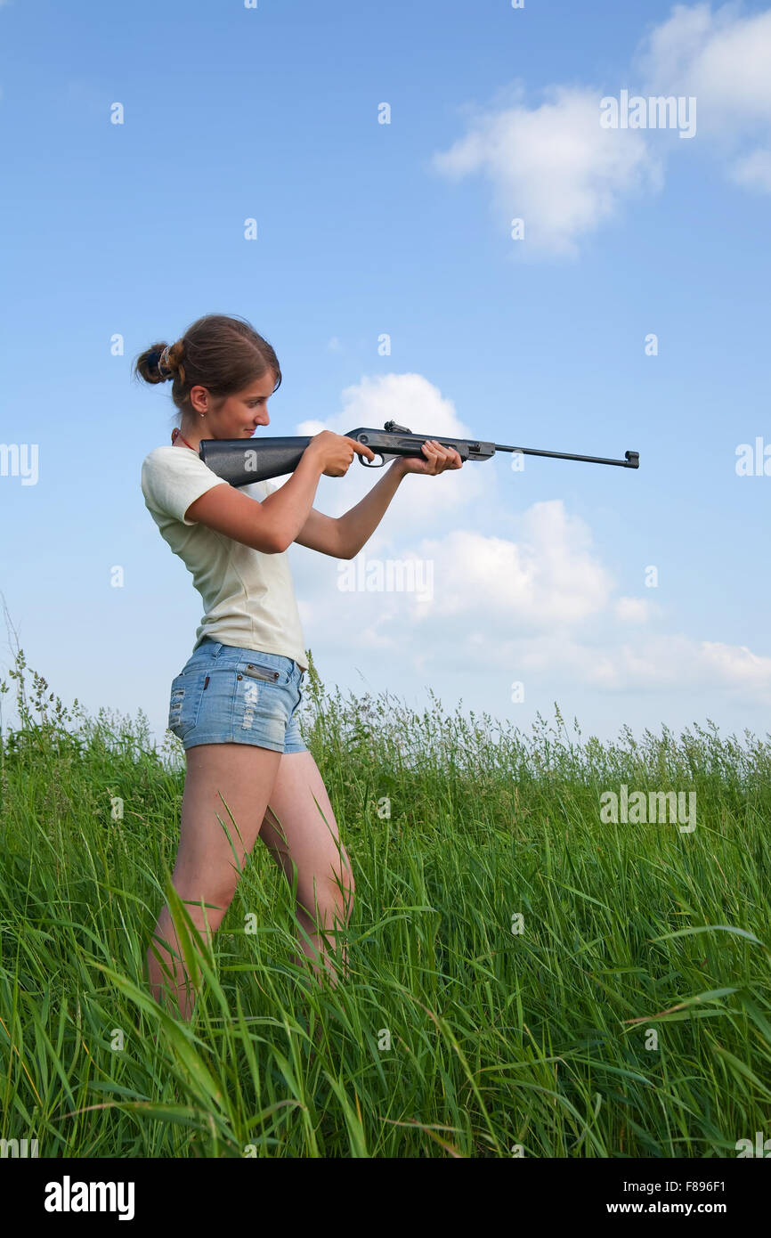 young woman aiming a pneumatic air rifle Stock Photo - Alamy