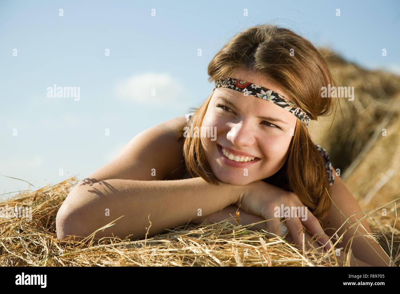 Country girl on fresh hay in summer Stock Photo - Alamy