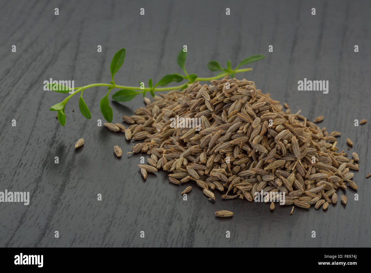 Zira seeds heap on the desk Stock Photo - Alamy