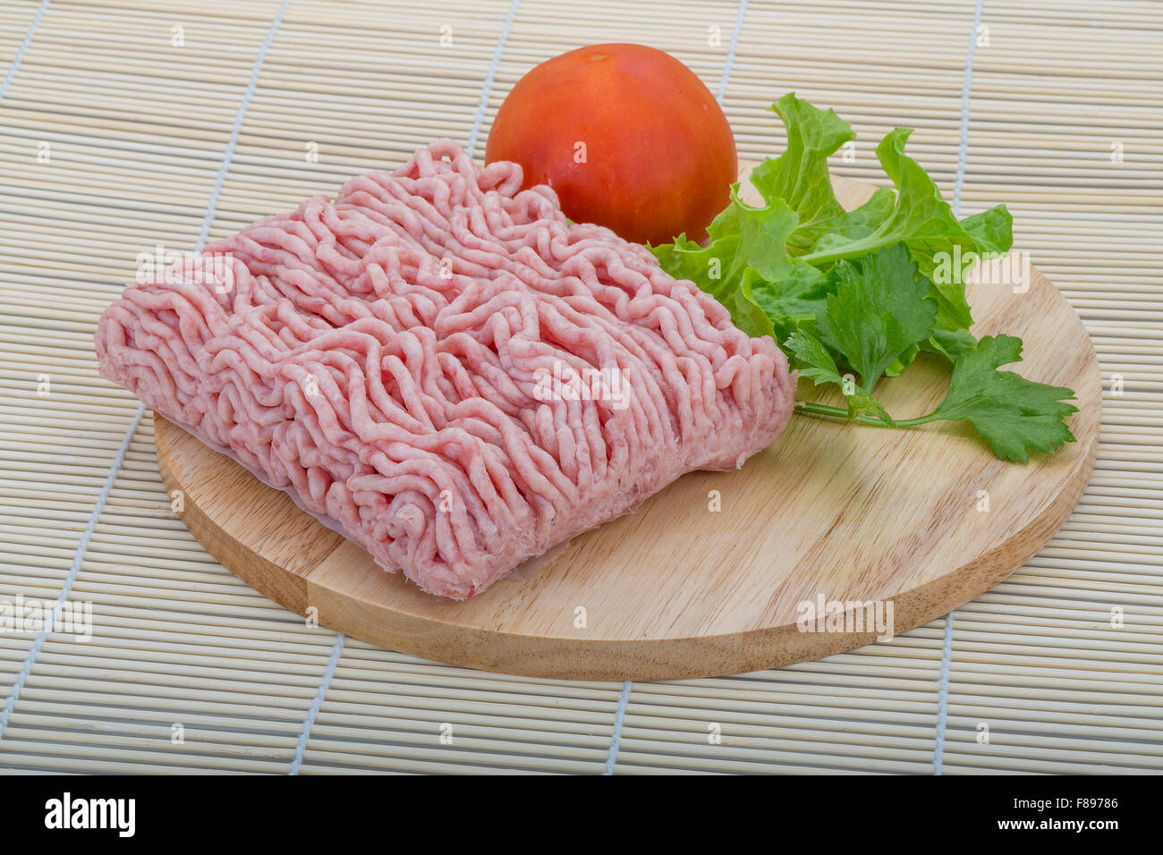 Raw minced pork meat on the desk with herbs Stock Photo - Alamy