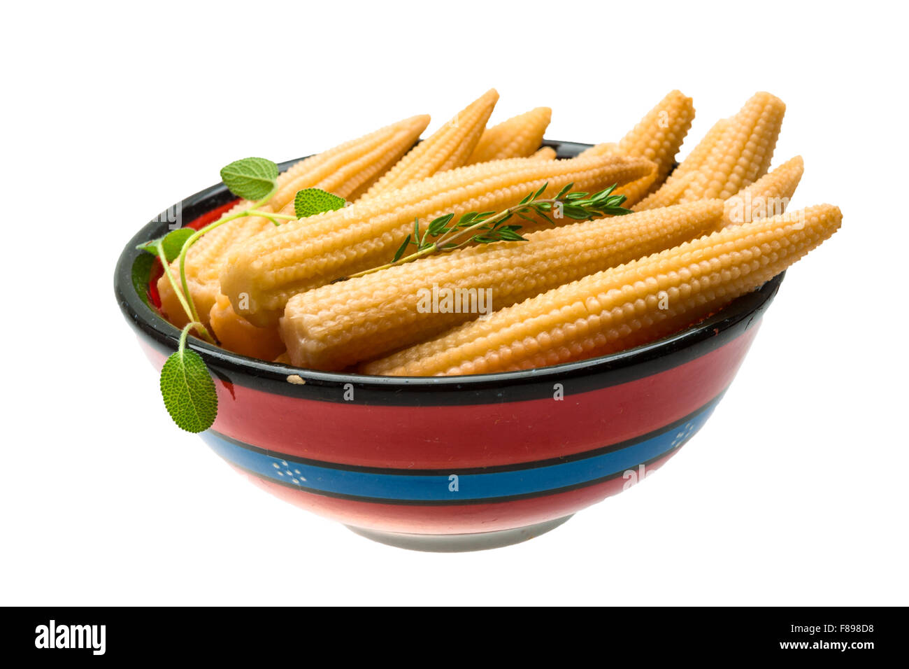 Baby corn with thyme Stock Photo - Alamy