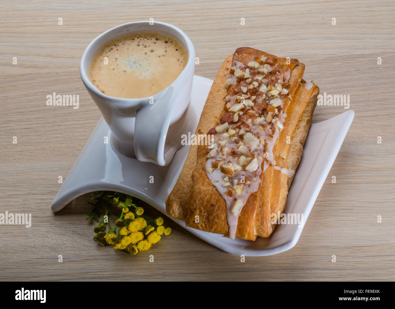 Coffee with bun for breakfast Stock Photo - Alamy