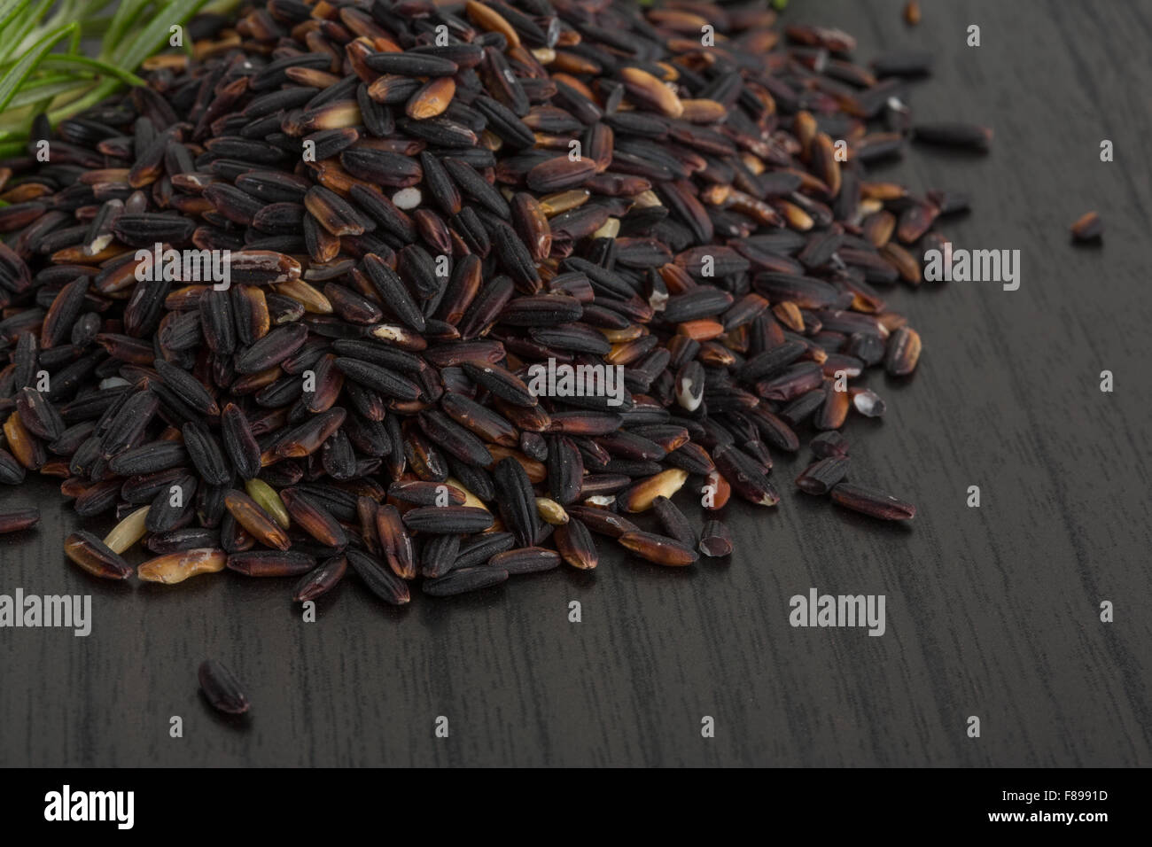 Raw wild rice with herbs Stock Photo - Alamy