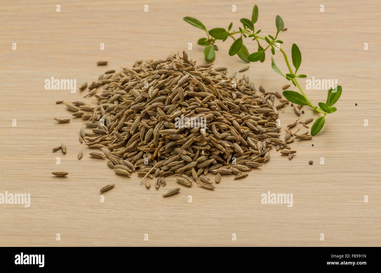 Zira seeds heap on the desk Stock Photo - Alamy
