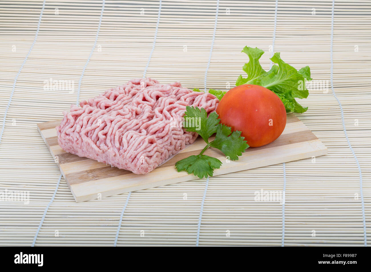 Raw minced pork meat on the desk with herbs Stock Photo - Alamy