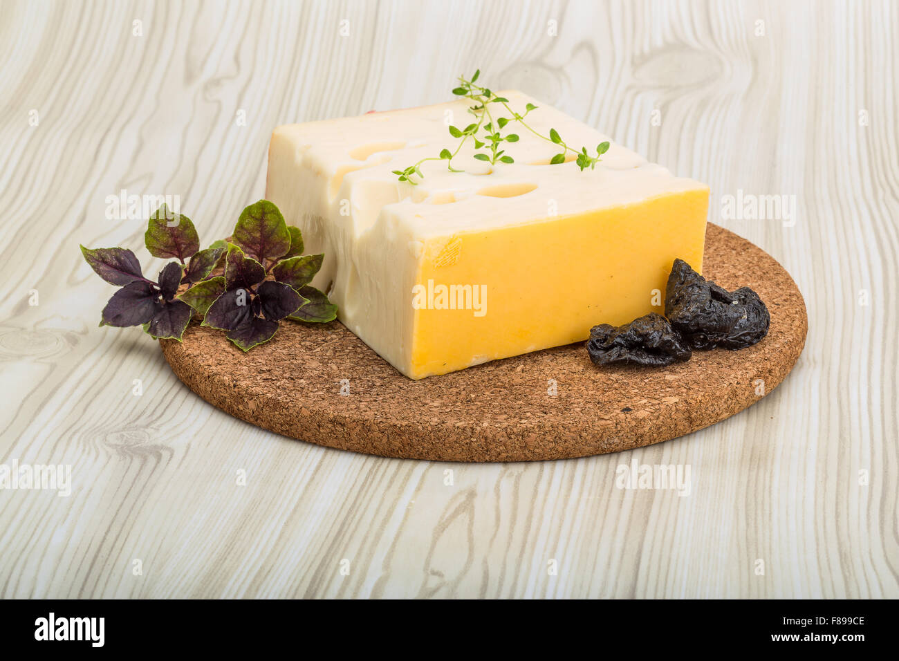 Yellow Cheese maasdam - with thyme and basil Stock Photo - Alamy
