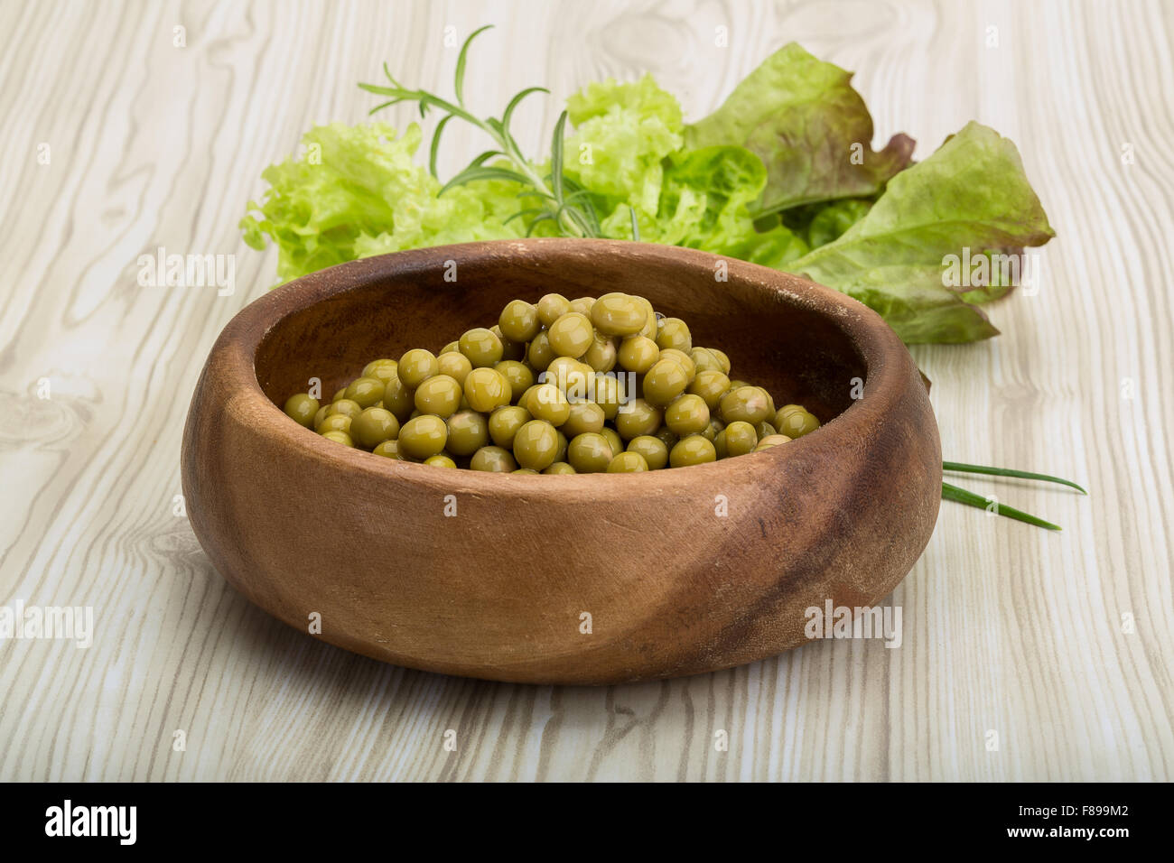 Marinated peas - in the bowl with salad leaves Stock Photo - Alamy