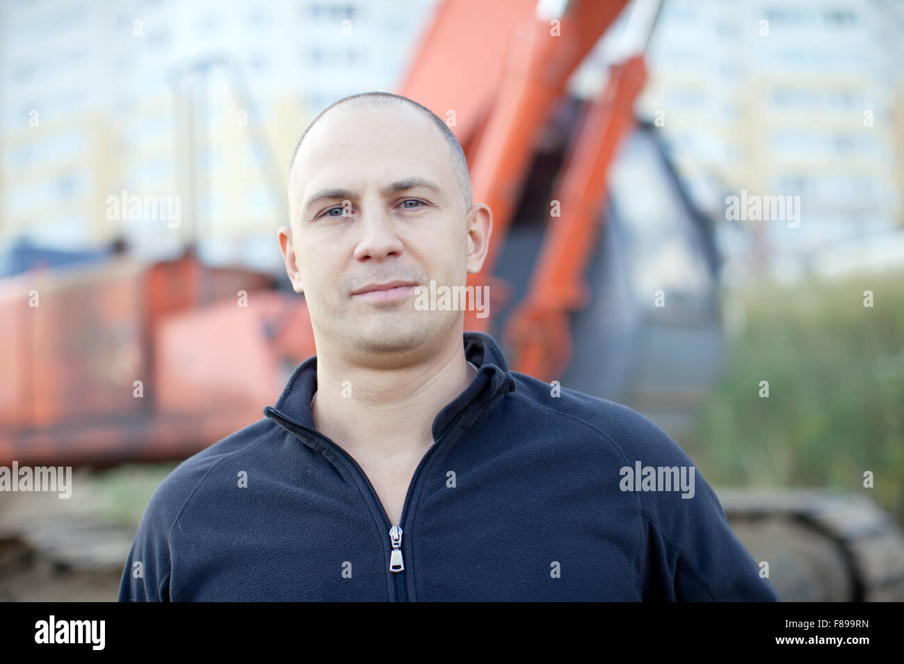 Portrait of manual worker at building site Stock Photo - Alamy