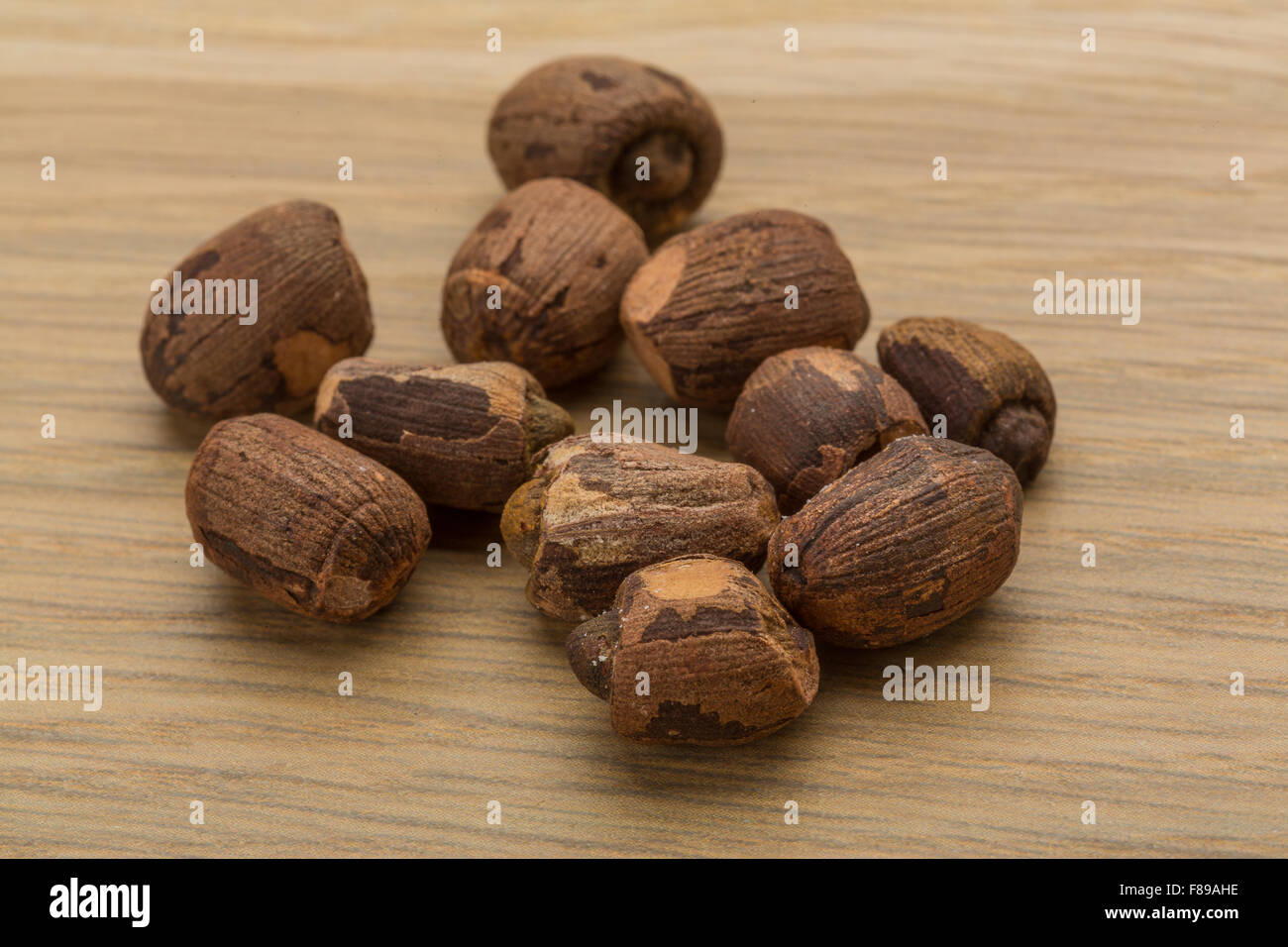 Small nutmeg on the desk Stock Photo - Alamy