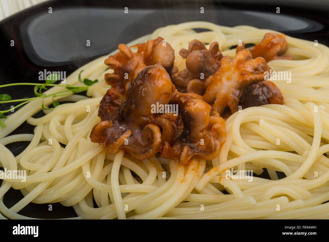 Pasta with octopus - italian spaghetti marinara Stock Photo - Alamy