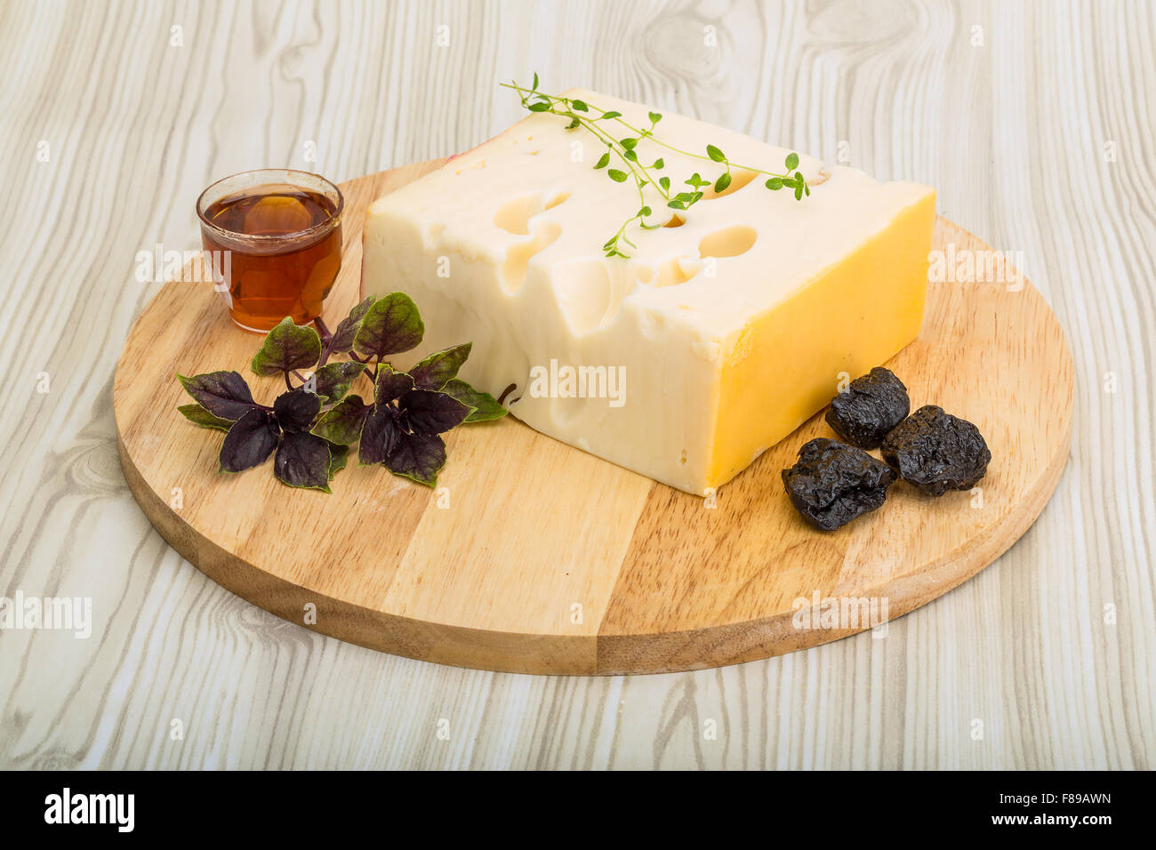 Yellow Cheese maasdam - with thyme and basil Stock Photo - Alamy