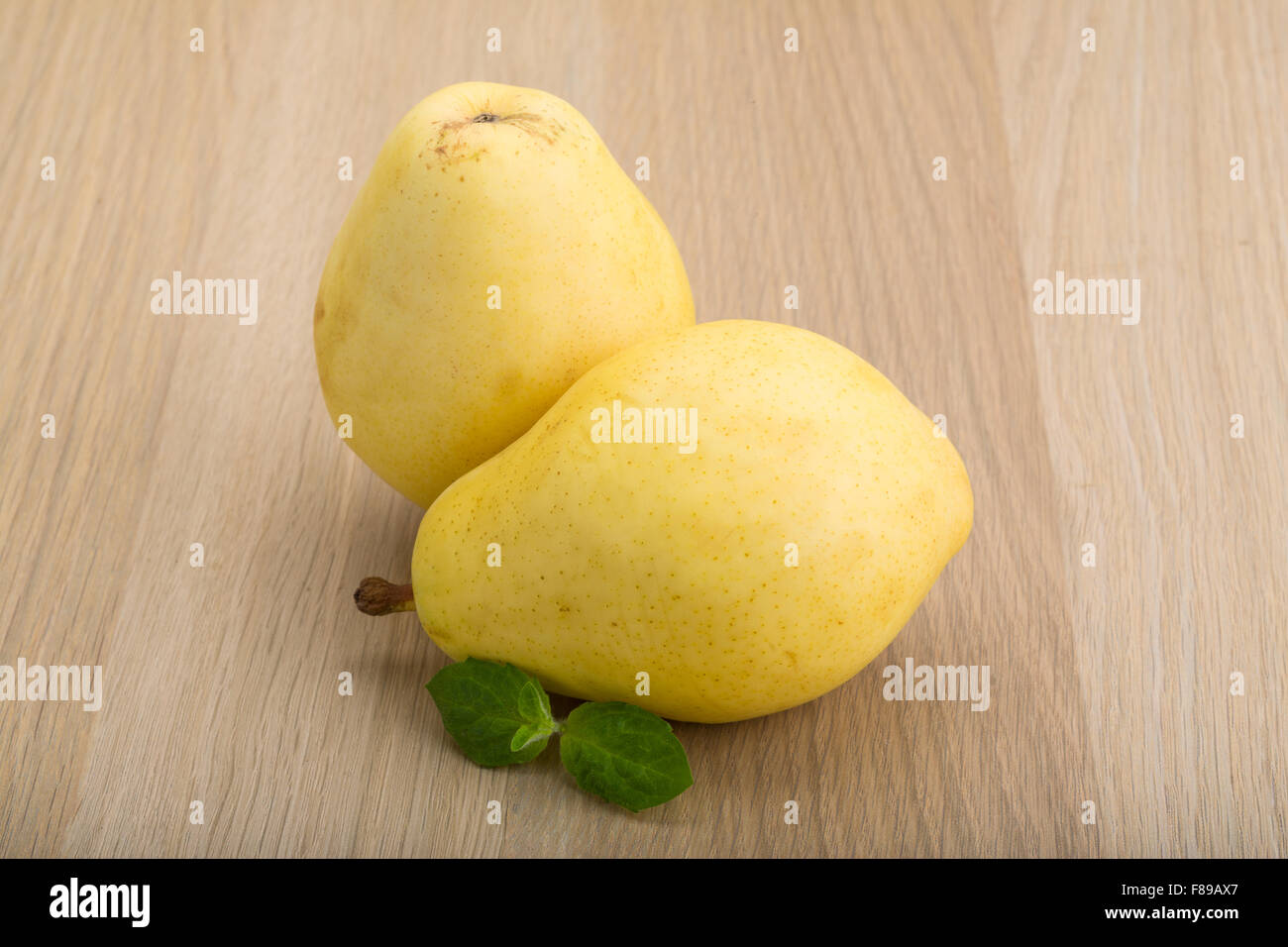 Bright ripe Yellow pears with mint leaves Stock Photo - Alamy