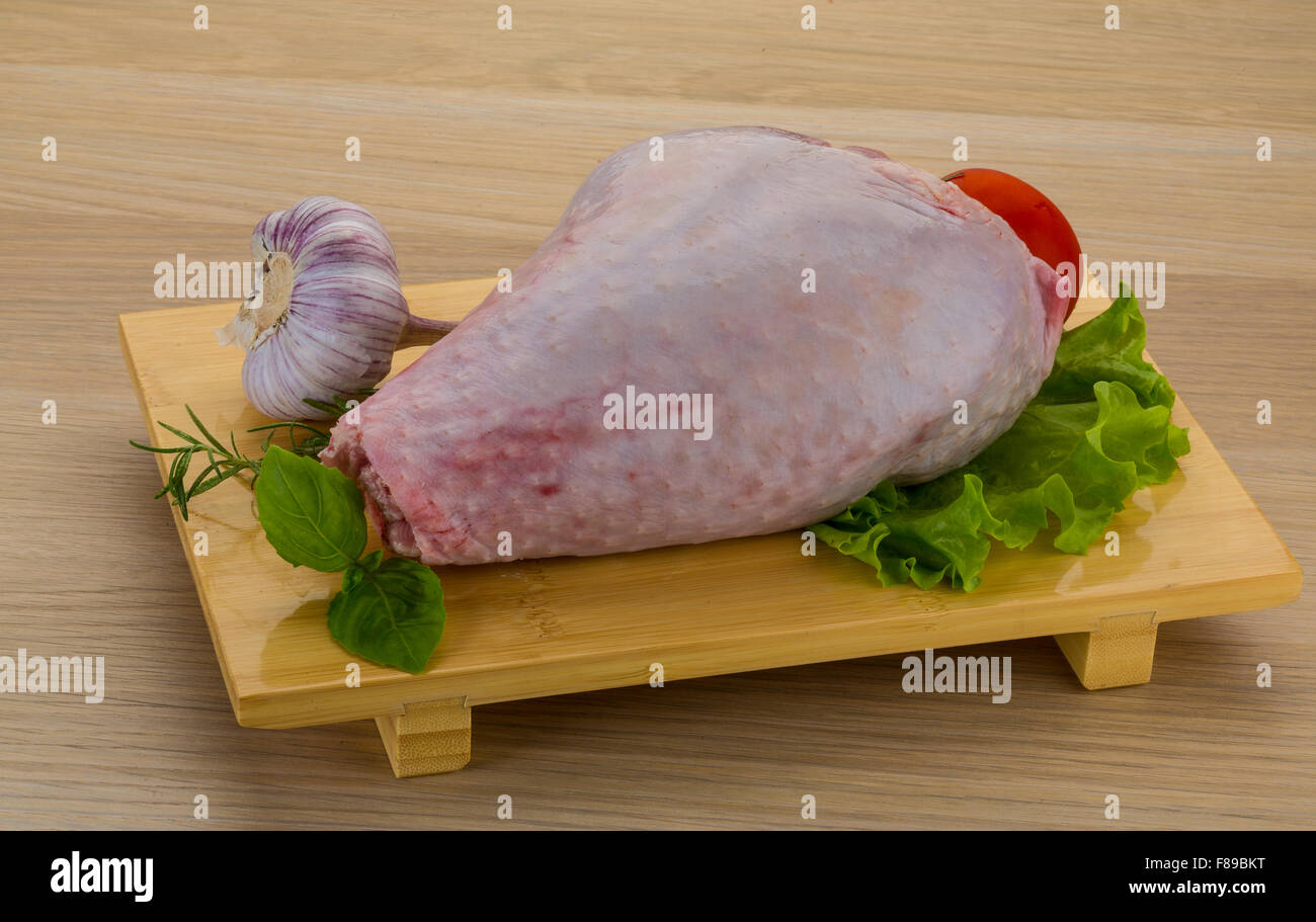 Raw Turkey leg on the board Stock Photo - Alamy